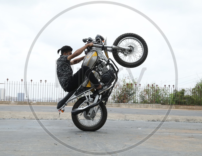Image of Stunt Man Performing Bike Stunts-CK488314-Picxy