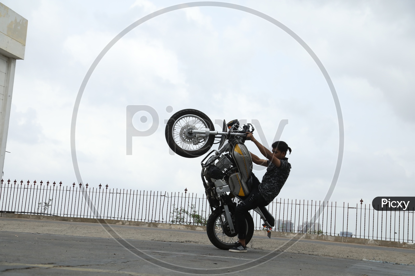 Image of A Biker Performing Stunts On Bike-ZQ528388-Picxy