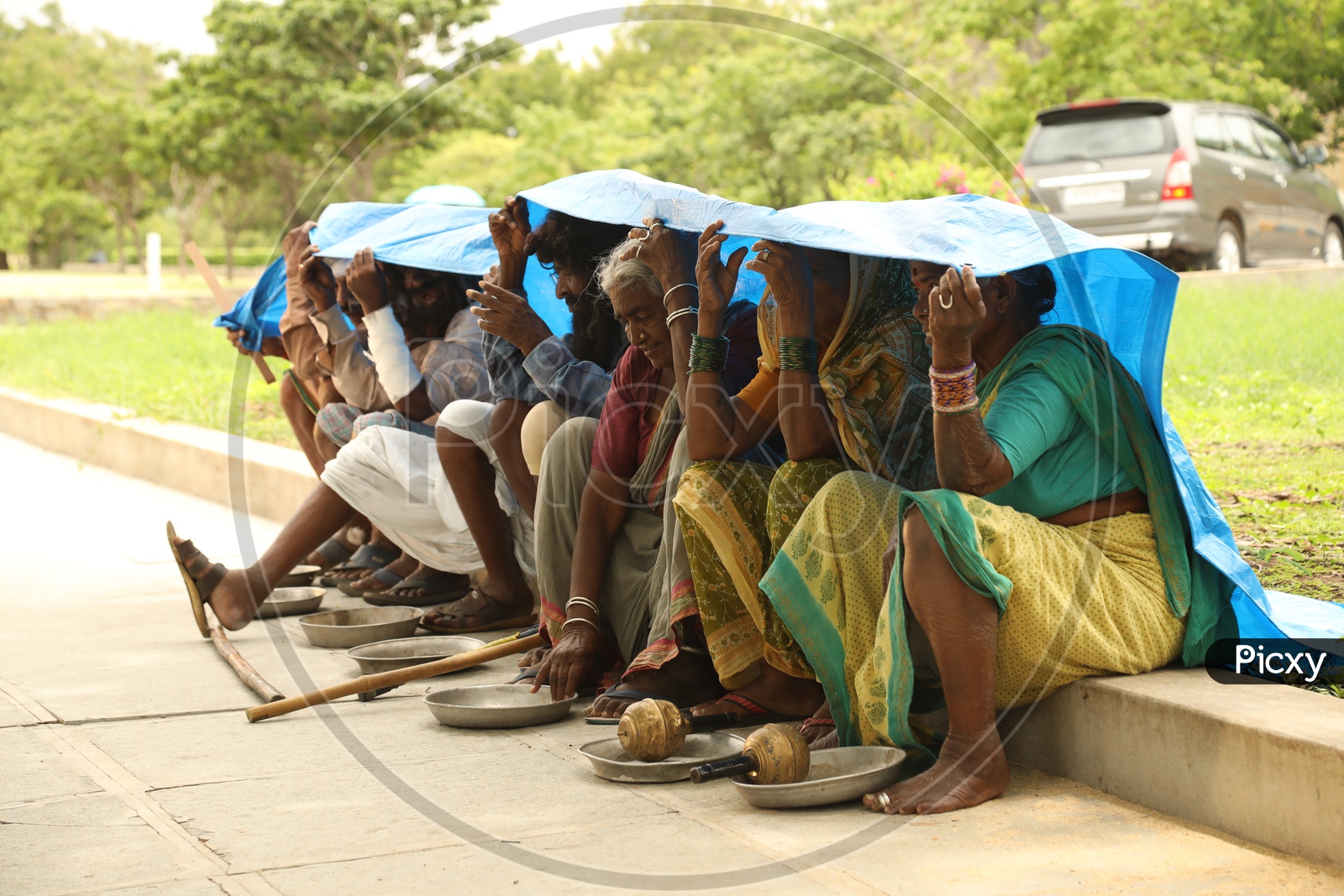 Image of Beggars Sitting On Road Side Platform-UB239494-Picxy