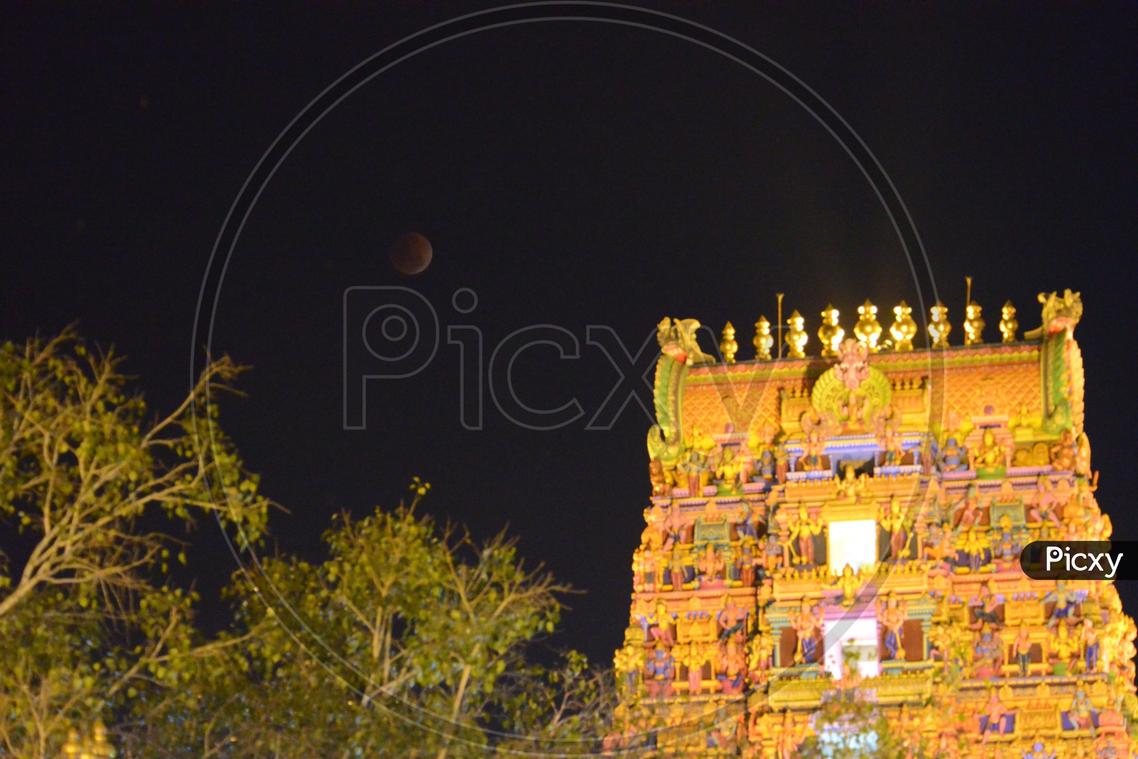 Image of Moon Lunar Eclipse Over Hindu Temple Shrine-YG900094-Picxy