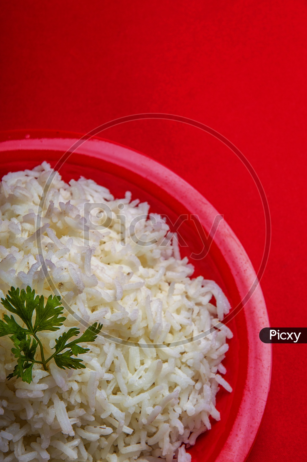 Image of Cooked plain white basmati rice in a red plate on red ...