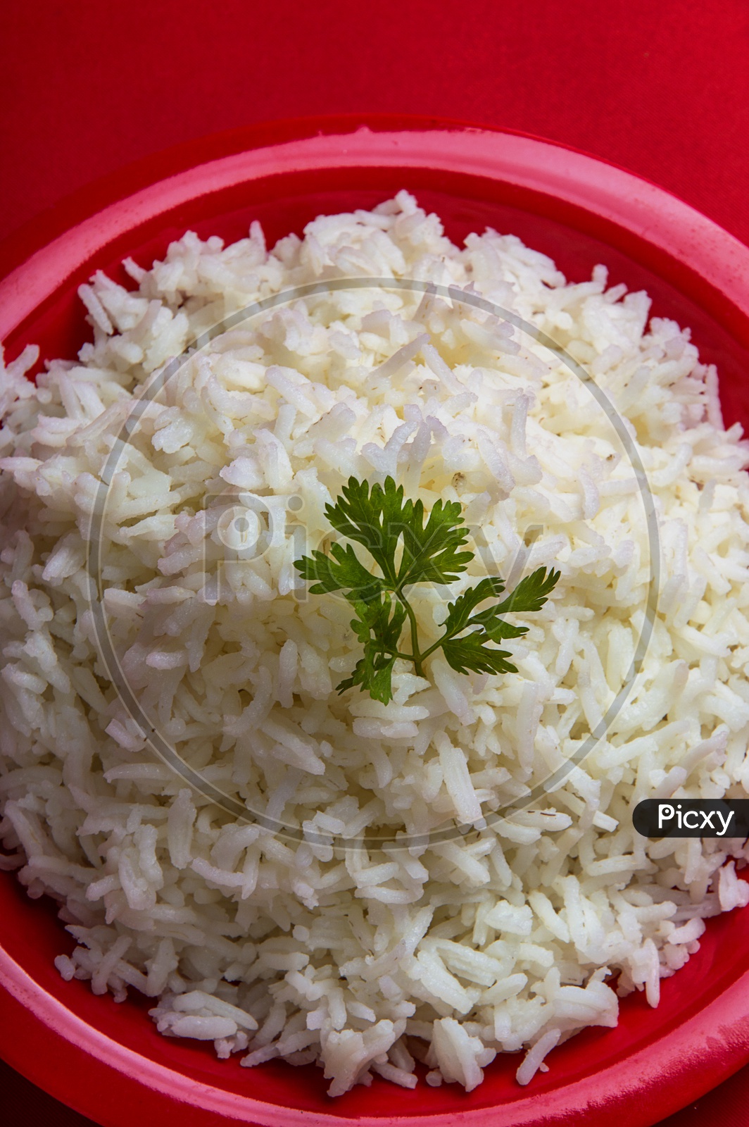 Image of Cooked plain white basmati rice in a red plate on red ...