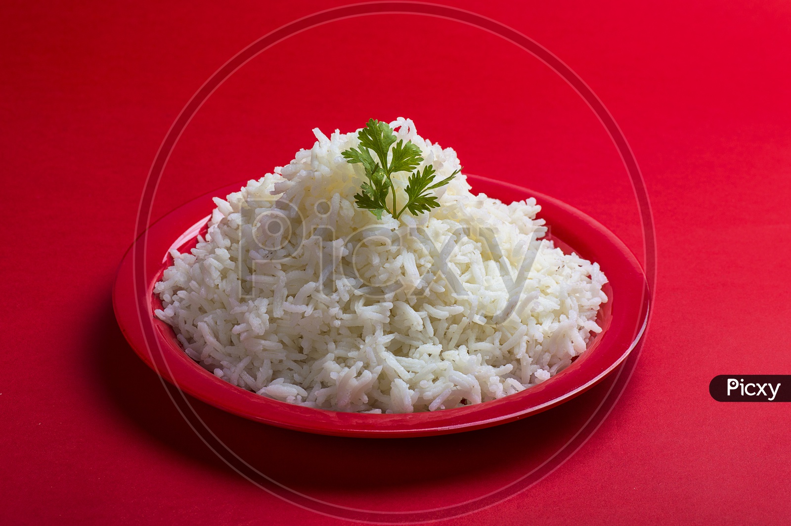 Image of Cooked plain white basmati rice in a red plate on red ...
