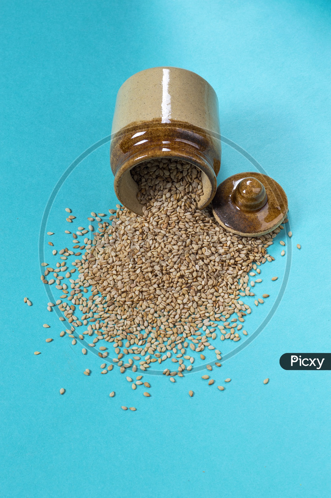 Image of Sesame Seeds in clay pot with blue background-TQ551554-Picxy