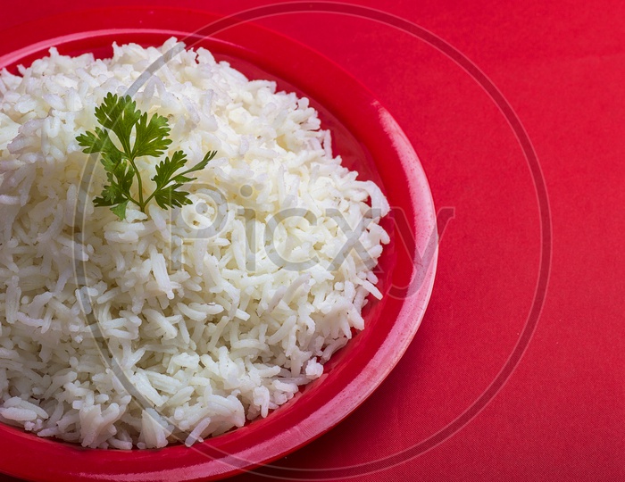 Image of Cooked plain white basmati rice in a red plate on red ...