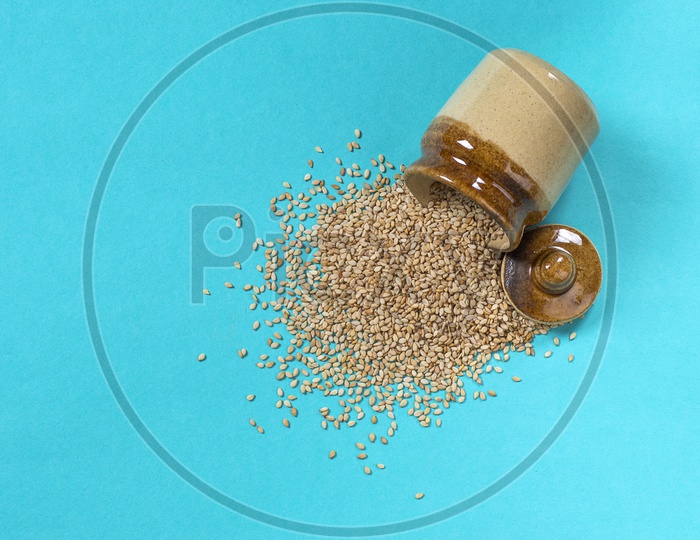 Image of Sesame Seeds in clay pot on blue background-ED077999-Picxy