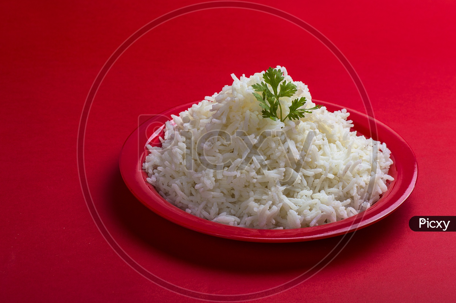 Image of Cooked plain white basmati rice in a red plate on red ...