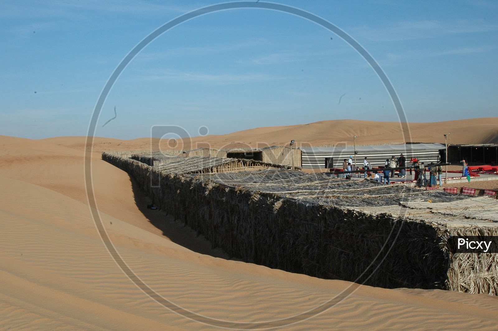 Image of Huts and people in the desert-ZA677436-Picxy