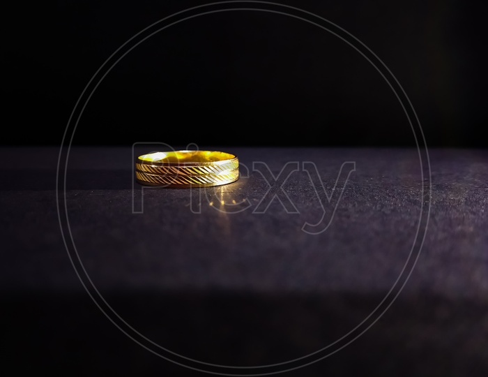Image of Gold finger ring with black background-FM087442-Picxy