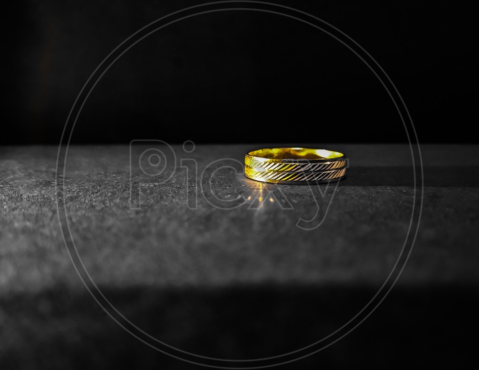 Image of Gold finger ring with black background-ZC928706-Picxy