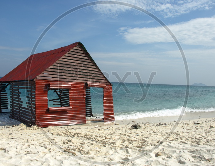 Image of Log cabin in beach-MC097509-Picxy