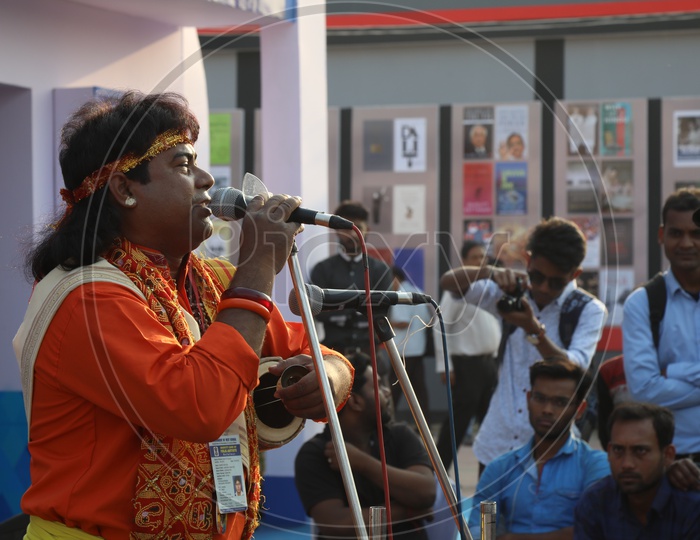 Image of An Artist Performing By Singing Devotional Songs on Stage ...