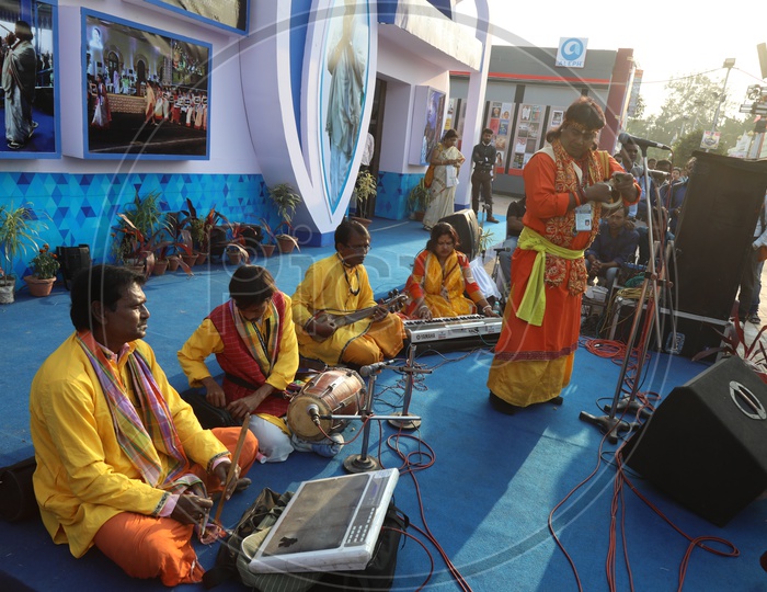 Image of An Artist Performing By Singing Devotional Songs on Stage ...