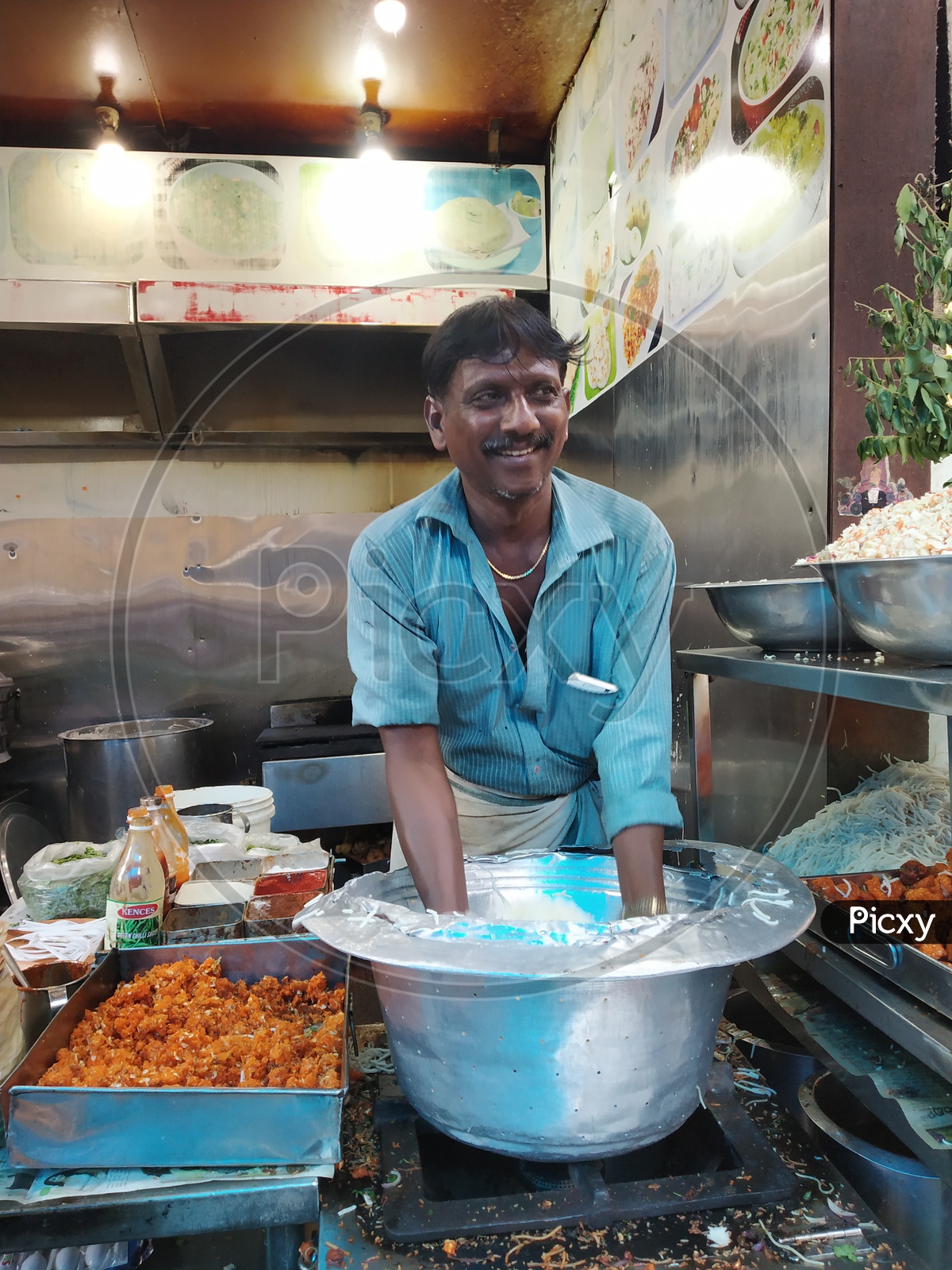 Image of Fast Food Vendor preparing the Noodles-QE495482-Picxy
