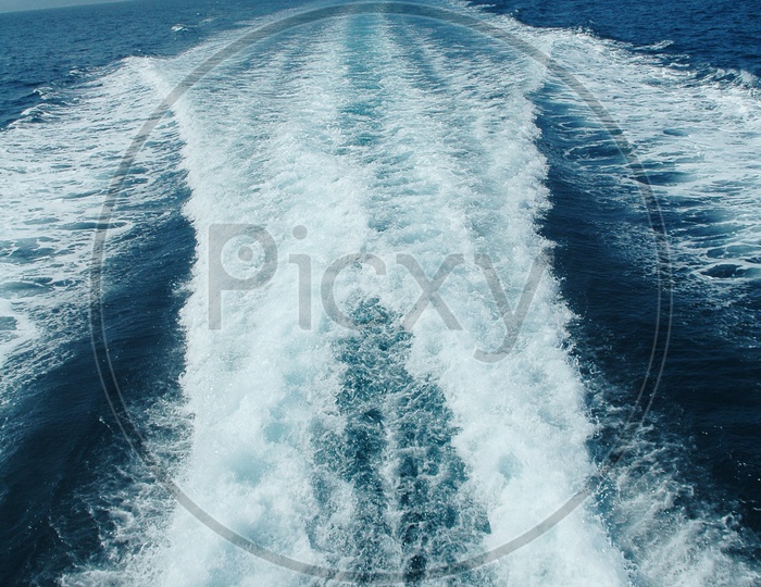 Image of Water Ripples Formed by Speed Boat Propellers-US658965-Picxy