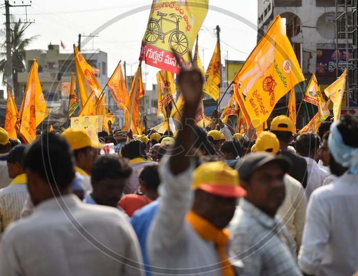 Image of TDP Party workers with Placards and flags in a rally ahead of Andhra Pradesh General ...