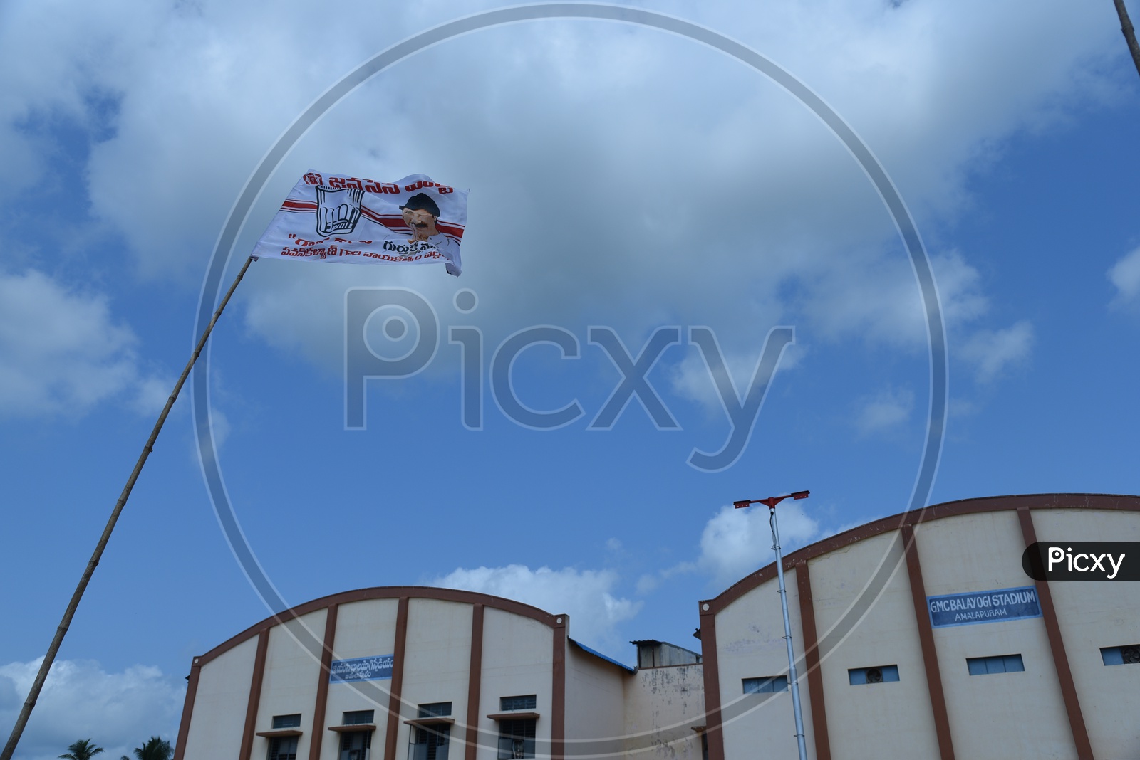 Image of Jana Sena party symbol 'glass tumbler' on a flag-UX068436-Picxy