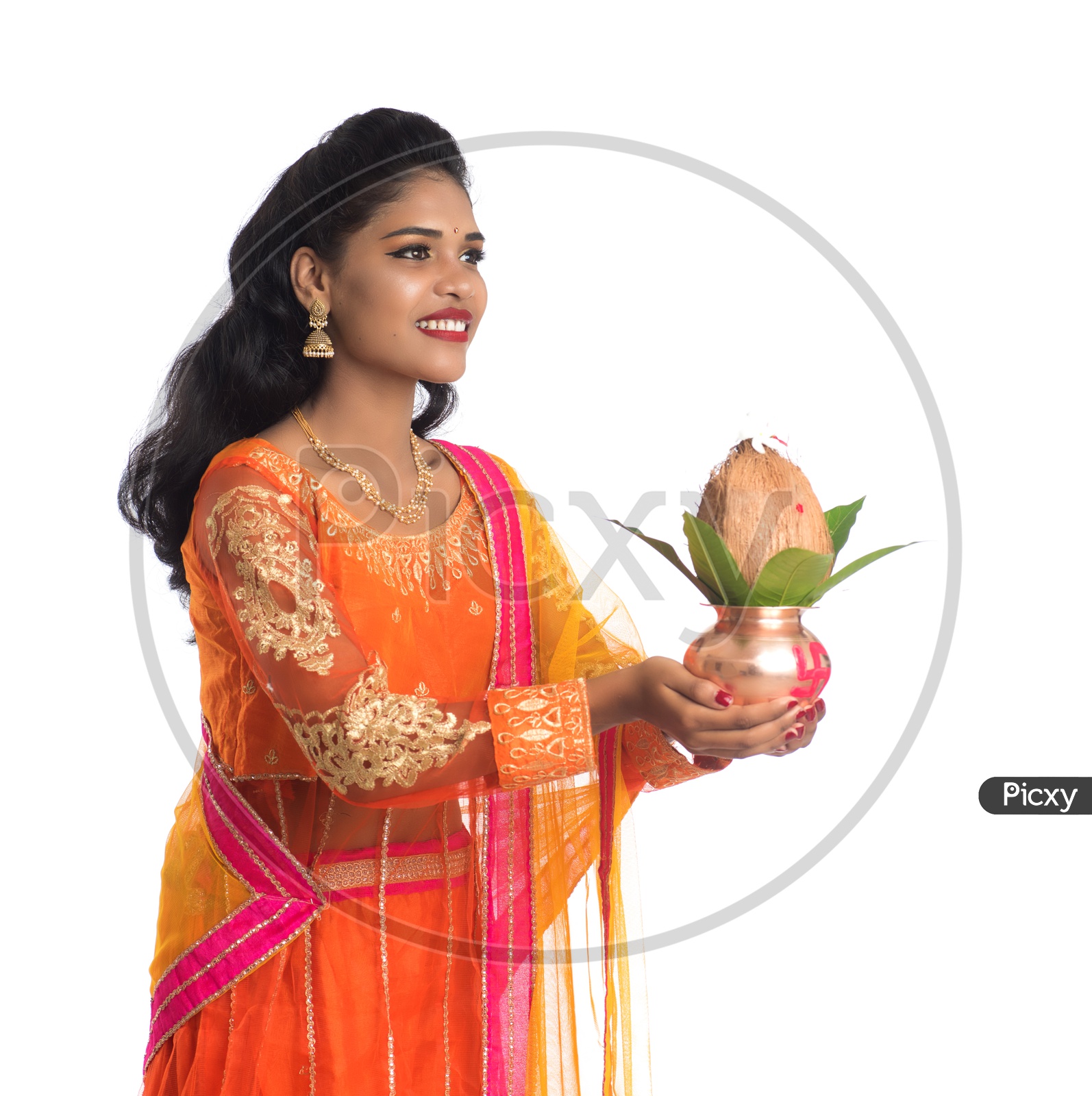 Image of A Young Traditional Indian Woman Holding Copper Kalash In Hand ...
