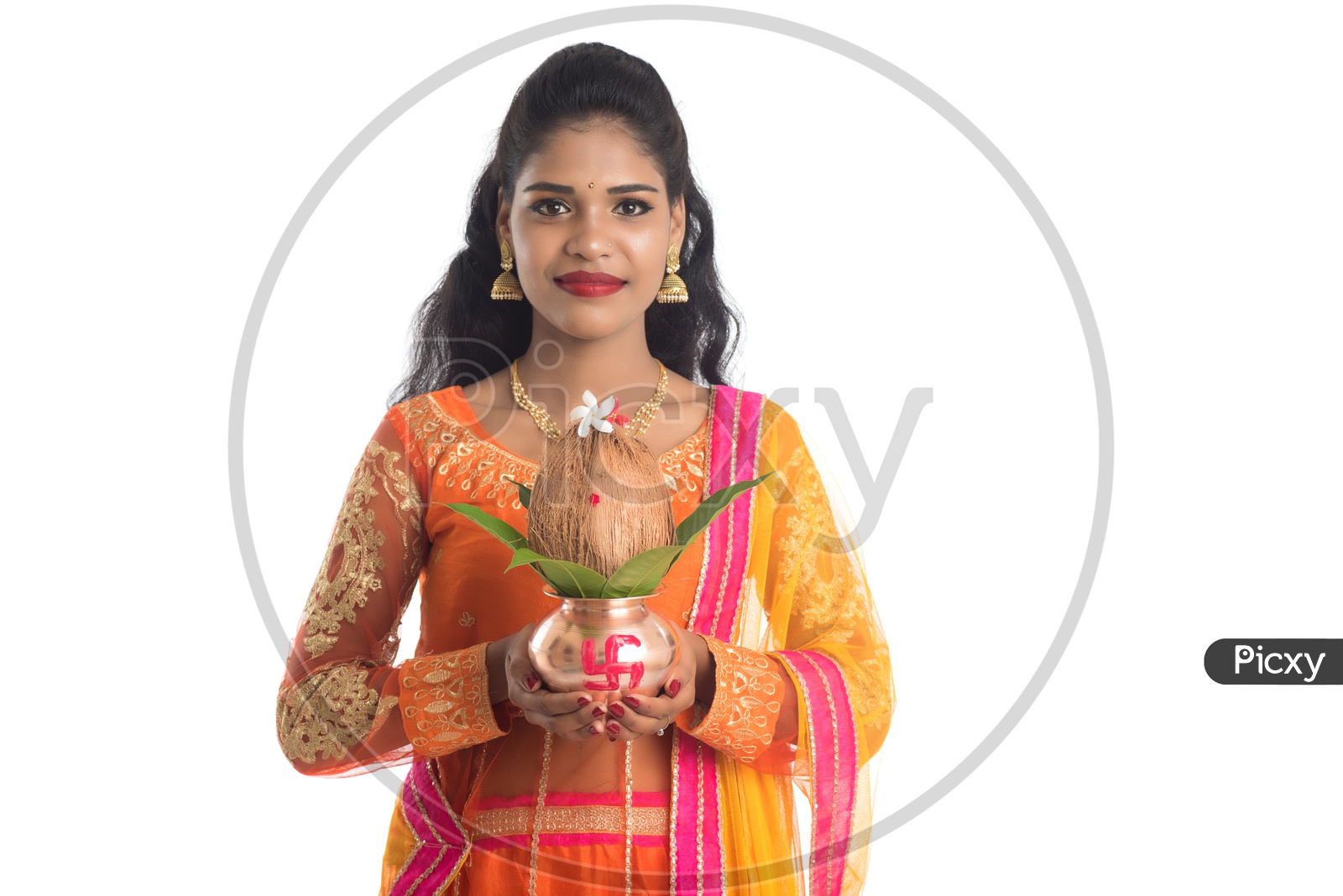Image of A Young Traditional Indian Woman Holding Copper Kalash In Hand ...