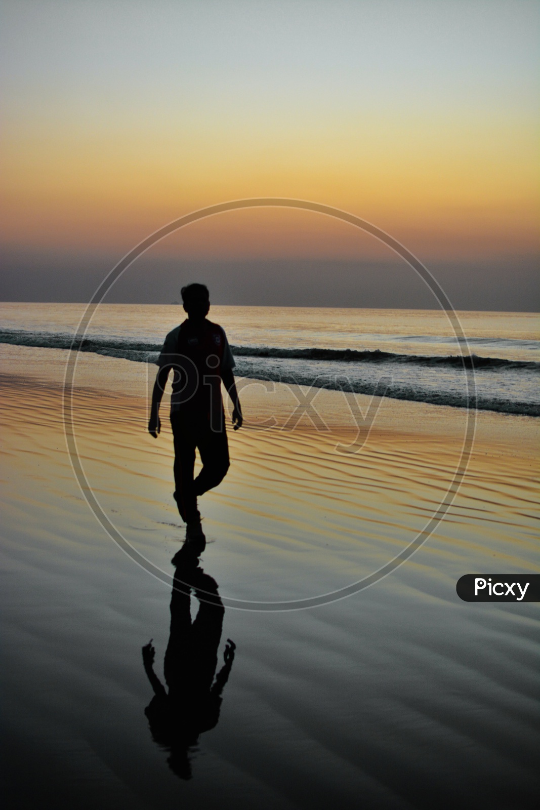 Image of Silhouette Of a Man Walking In Beach-SP791804-Picxy