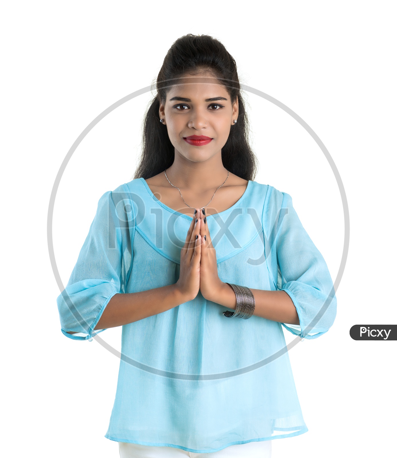 Image of Portrait Of a Young Indian Girl Doing a Namaste Gesture With a ...