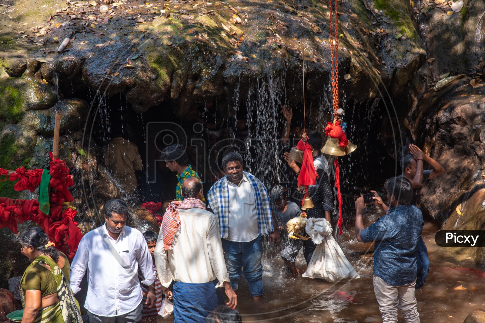 Image of Devotees near a waterfall at Gubbala Mangamma Thalli Temple ...