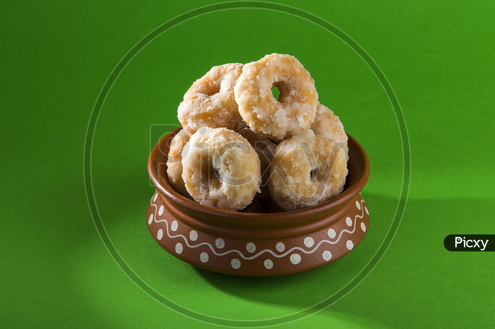 Image of Indian Sweet or Savoury Badhusha Pile In a Pot-YV955763-Picxy