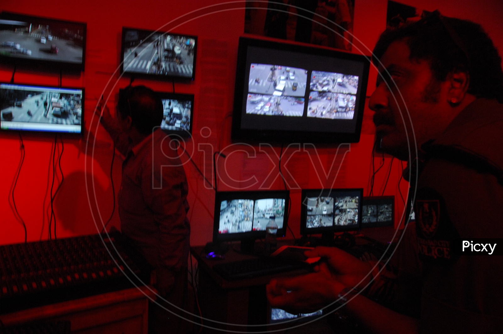Image of A Man Or Technician Monitoring The CCTV Live Footage In a ...