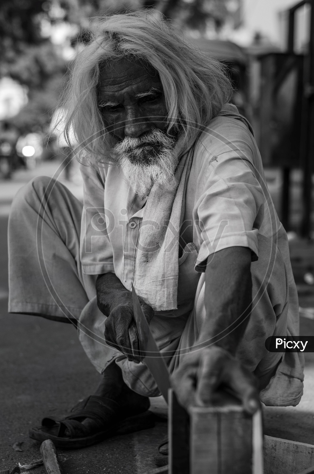 Image of An Old Man Carpenter Cutting Wood-OR679275-Picxy