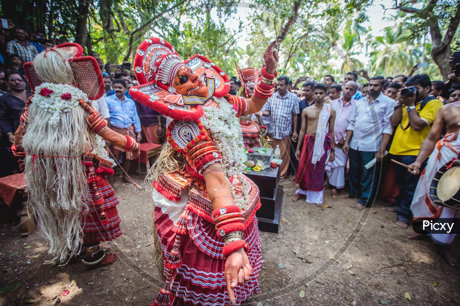 Image of Performers in colourful costume during the performance of ...