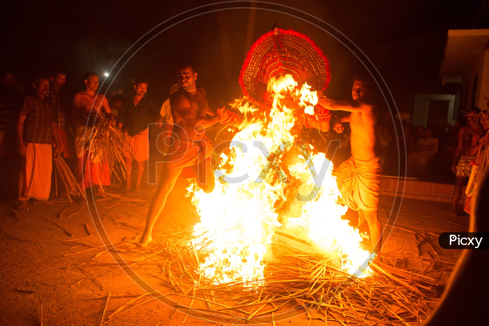 Image of Theyyam Artists Performing Around The Fire At Bhagawathi Amman ...