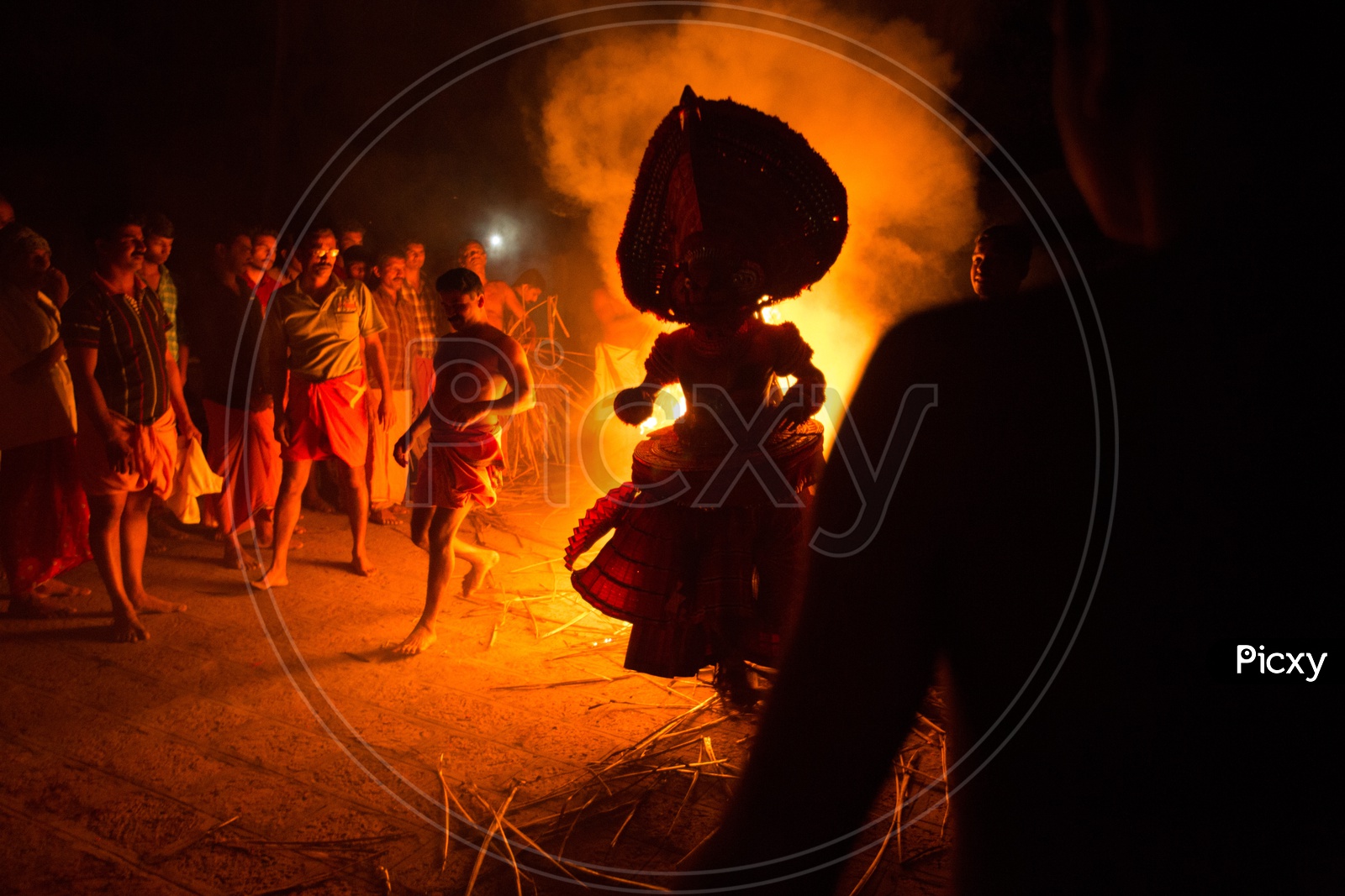 Image of Theyyam Artists Performing Around The Fire At Bhagawathi Amman ...