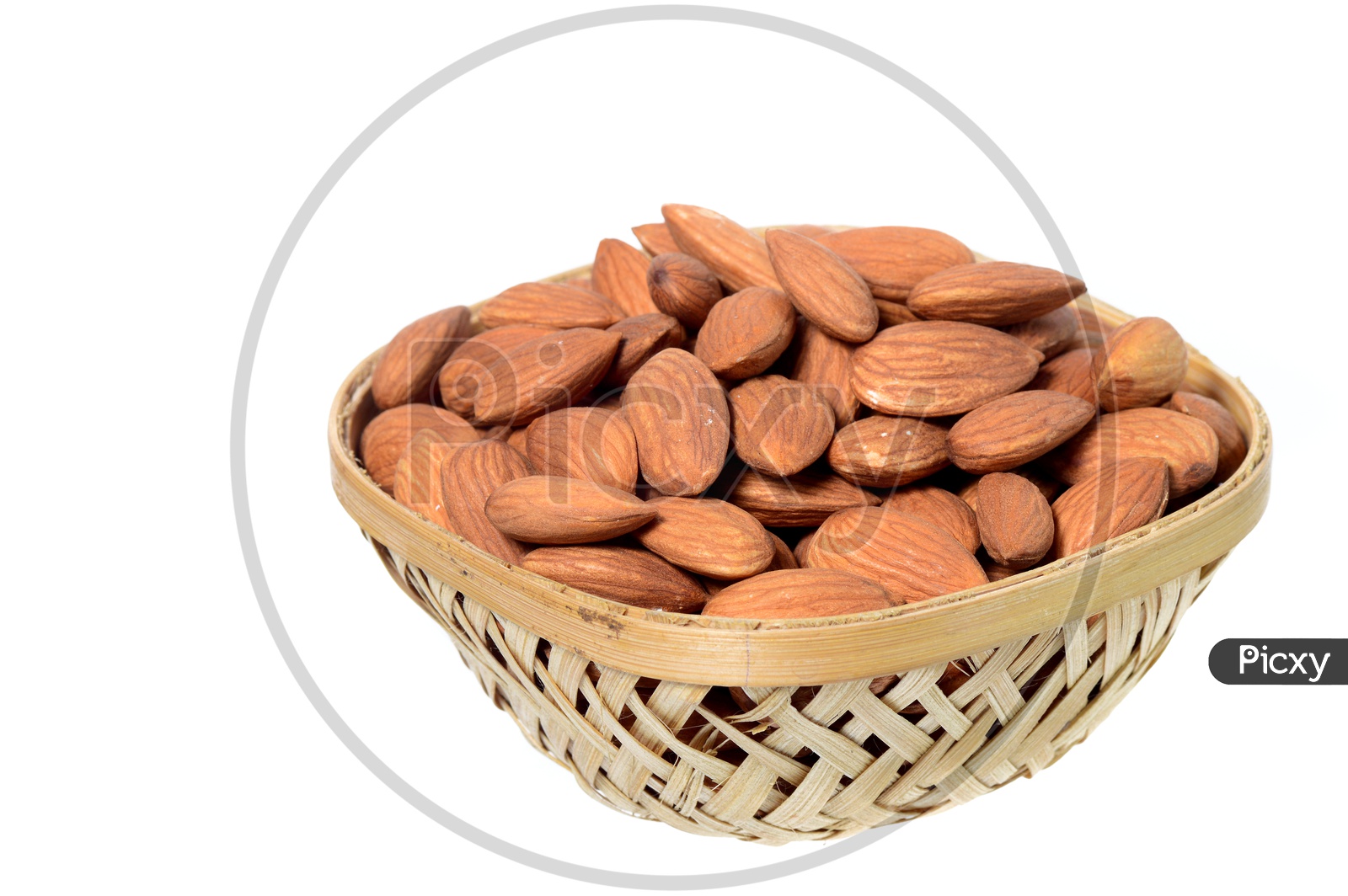 Image of Almonds Or Badam On a Wooden Weaved Bowl On An Isolated White ...
