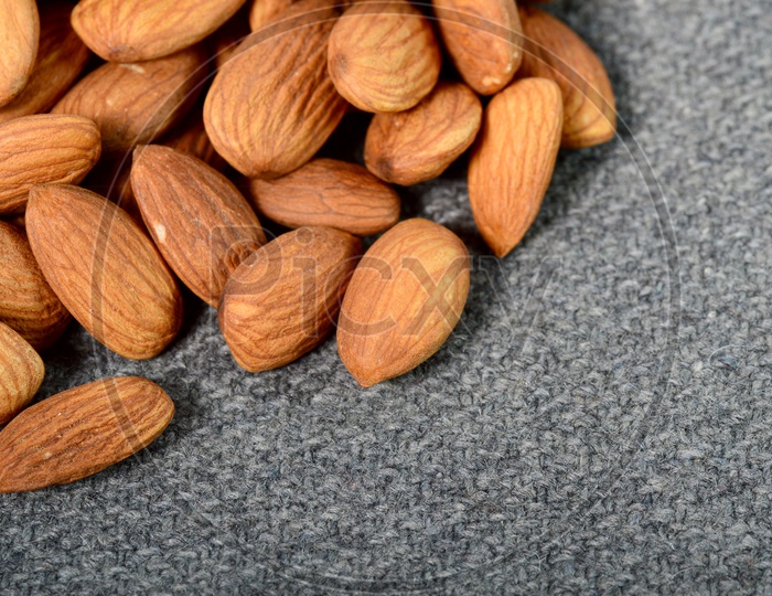 Image of Almonds Or Badam Nuts Pile On an Isolated White Background ...