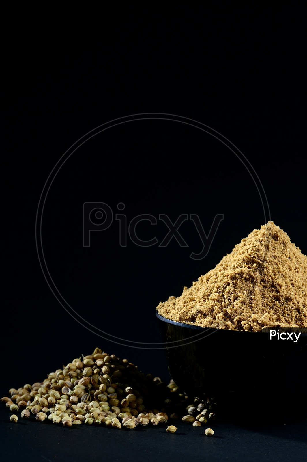 Image of Coriander Powder and Coriander seeds on black background ...