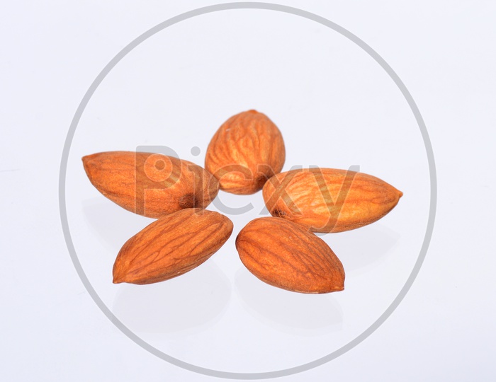 Image of Almonds Or Badam Nuts Arranged On an Isolated White Background ...