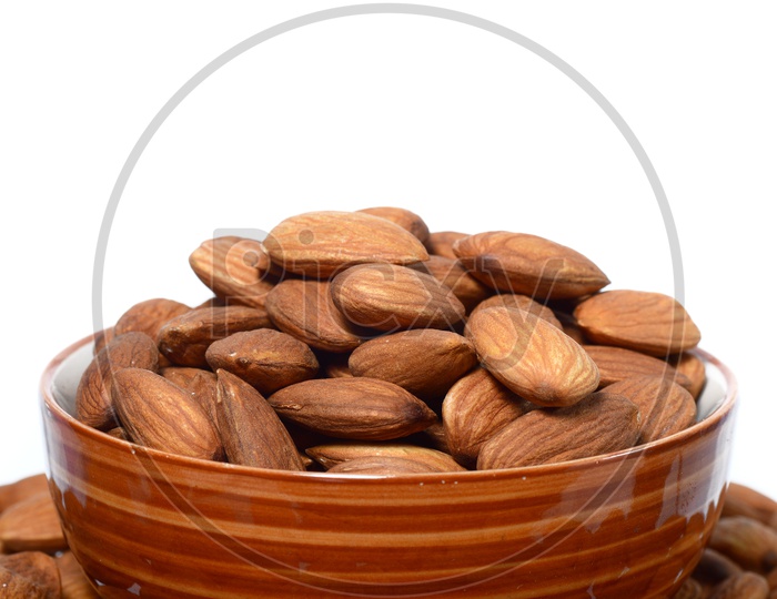 Image of Almonds Or Badam Nuts Heap In a Bowl On an Isolated White ...