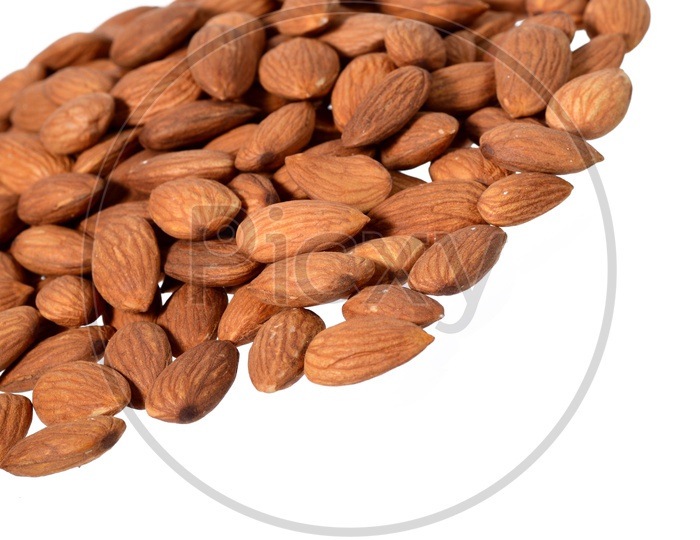 Image of Almonds Or Badam Nuts Pile On an Isolated White Background ...