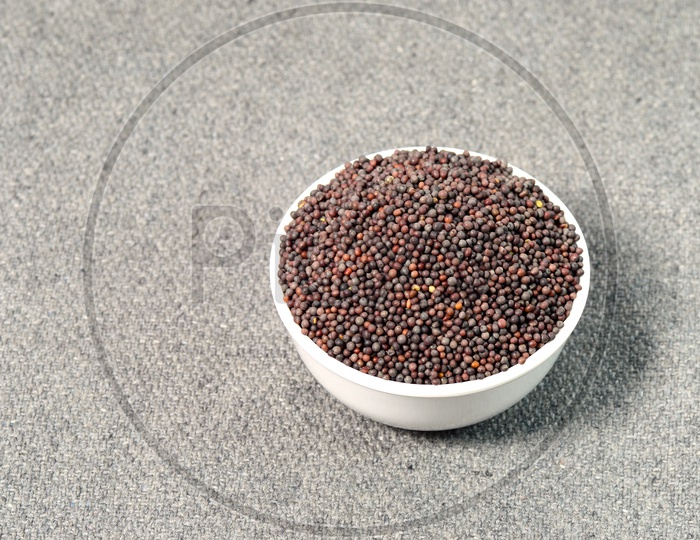 Image of Indian Brown Mustard Seeds in bowl on sackcloth Background ...