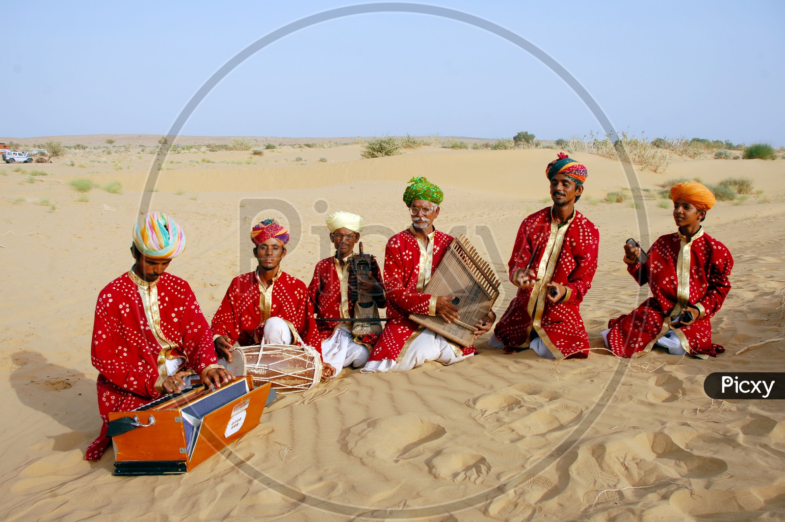 Image of Rajasthani Men playing musical instruments in desert-DR892036 ...