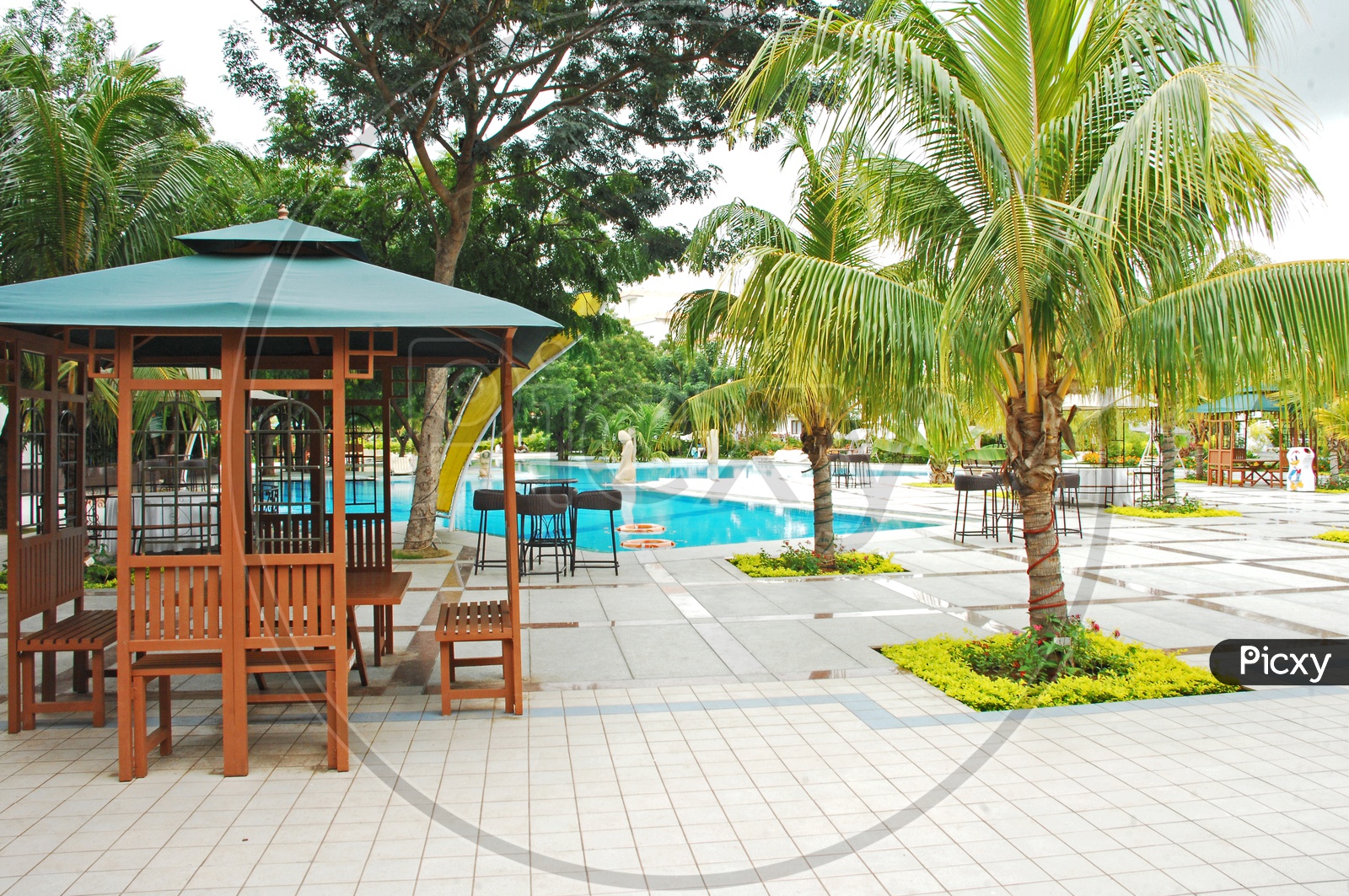 Image of A Resort With a Pool Side restaurant-FT622143-Picxy