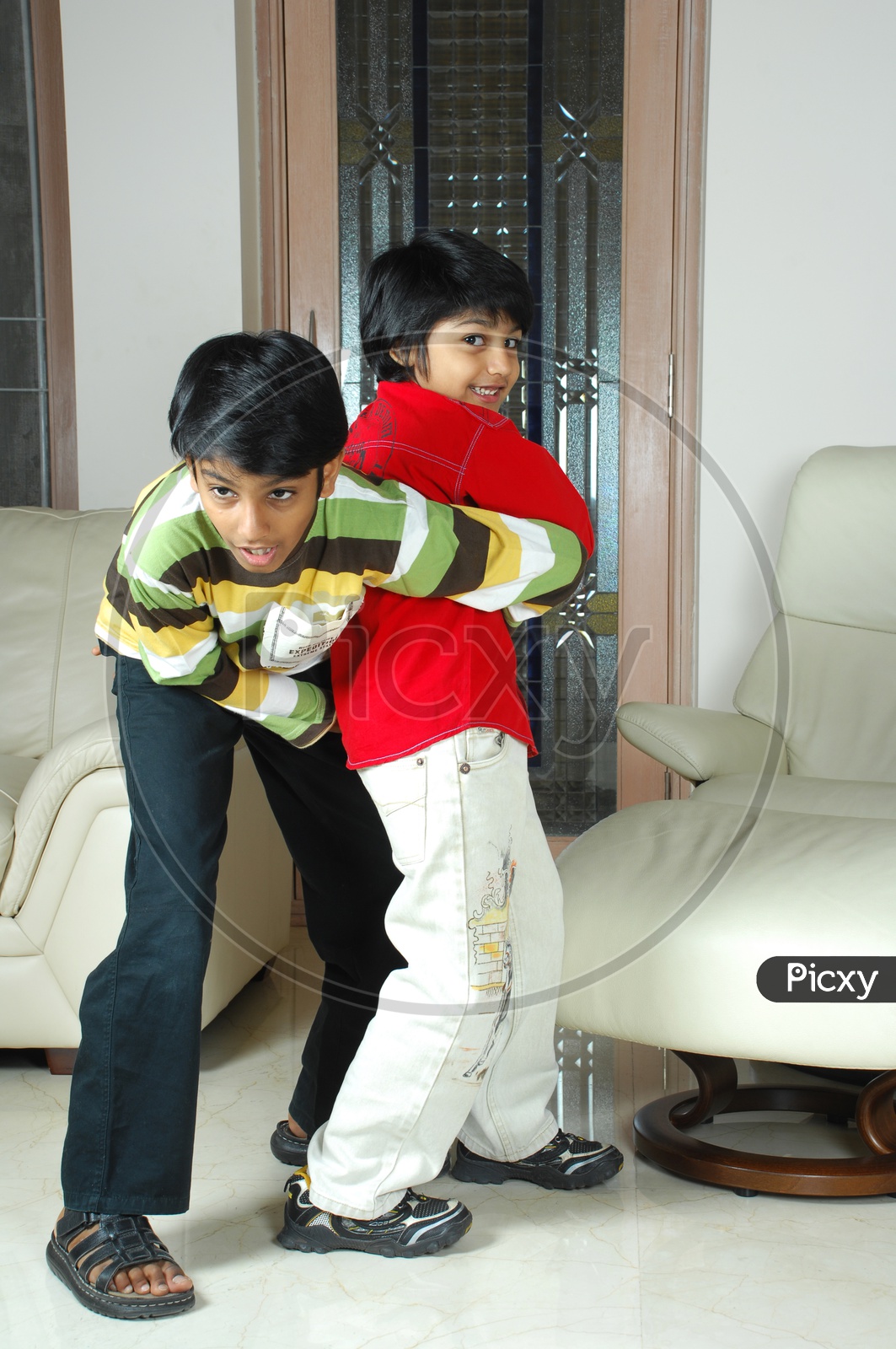 Image of Two Indian boys fighting playfully-XD664133-Picxy