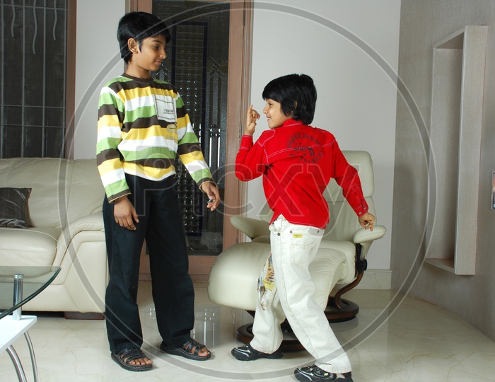 Image of Two Indian boys fighting playfully-XD664133-Picxy