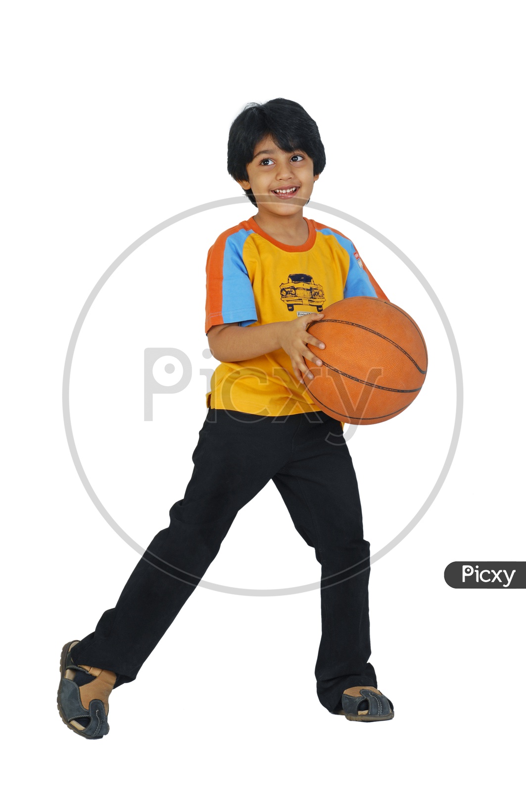 Image of An Indian boy playing with basketball in white background ...