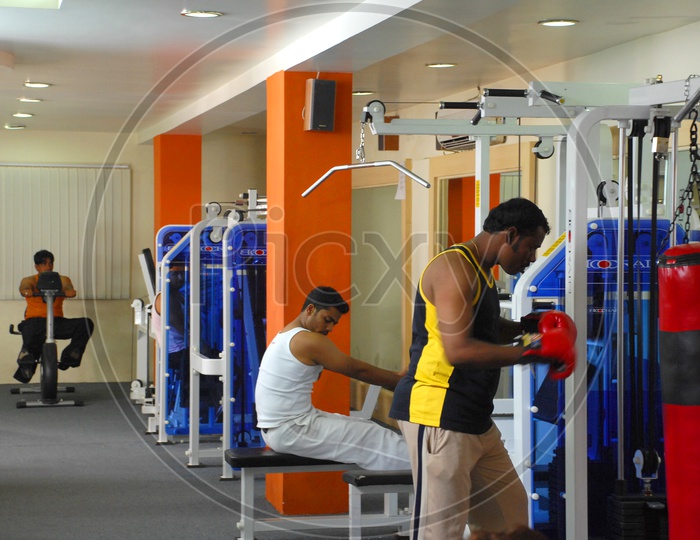 Image of Indian men exercising in the gym-YA155684-Picxy