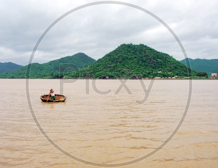Image of Indian People Sailing on Coracle-PC384716-Picxy