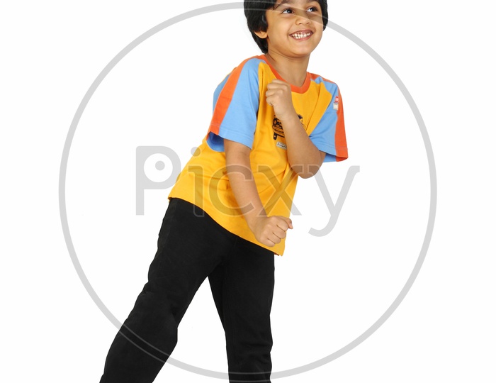 Image of An Indian boy dancing in white background-UG995518-Picxy