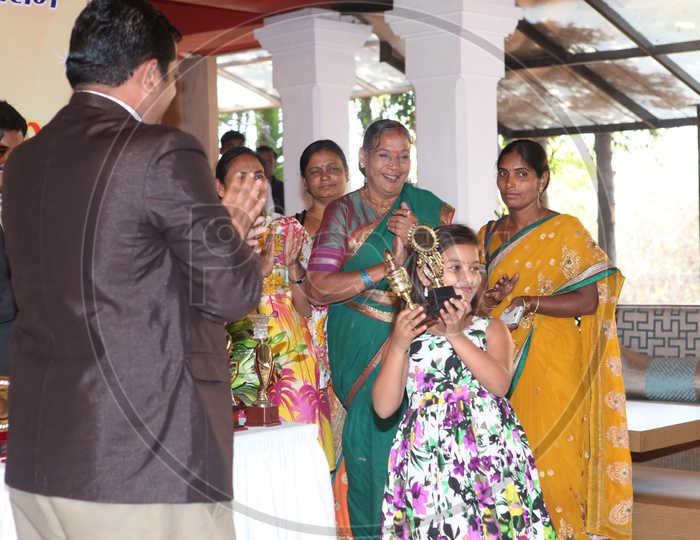 Image of A Young Indian Girl Receiving Award Or Shield From Dignitary ...