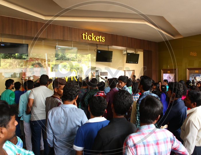 Image of Movie Watchers in Queue Lines For Tickets At a Theater ...