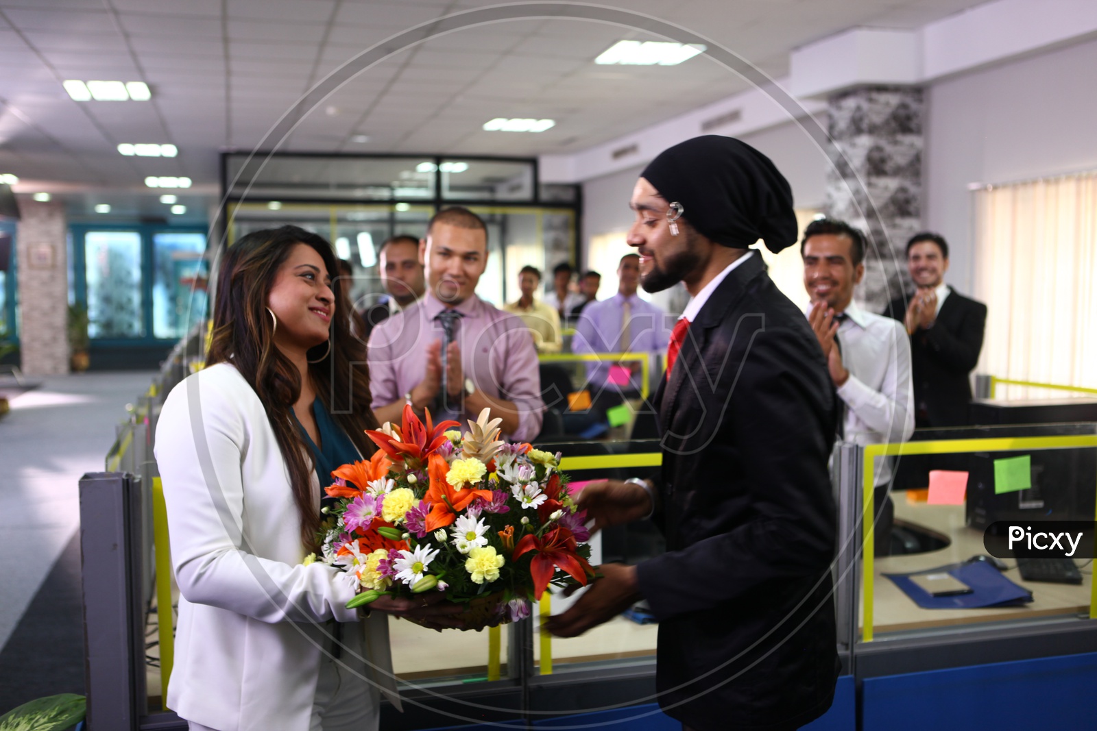 Image of Office Staff Welcoming Young Lady Boss Into Office With a ...